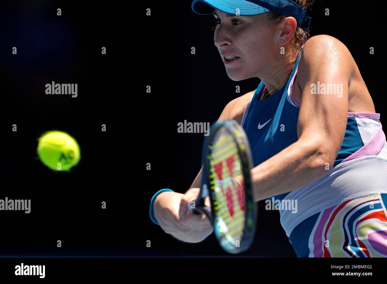 Belinda Bencic of Switzerland plays a backhand return to Camila Giorgi ...
