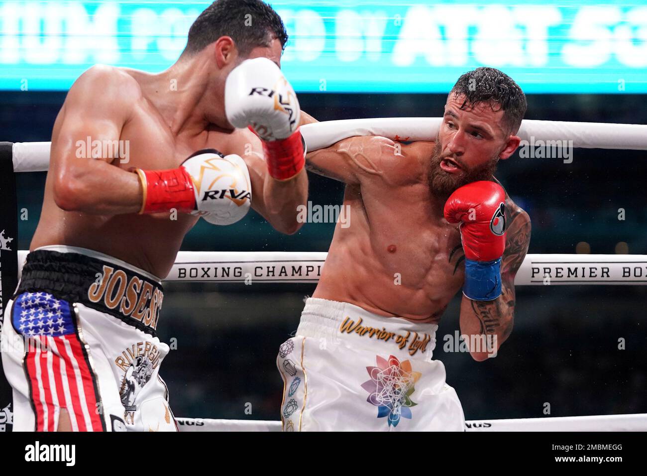 Cody Crowley, right, from Canada, tries to avoid punches by Josetito ...