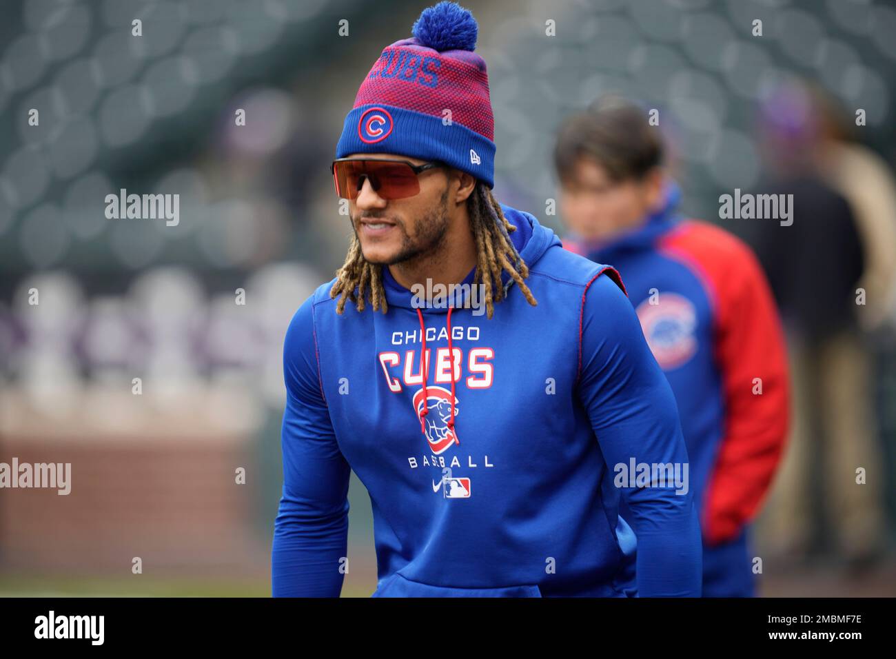 Chicago Cubs center fielder Michael Hermosillo wears a stocking hat as ...