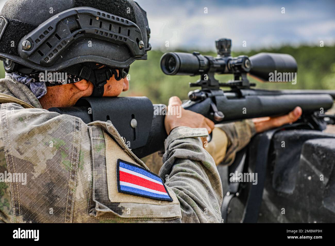A Costa Rican sniper prepares to fire down range during the combined ...
