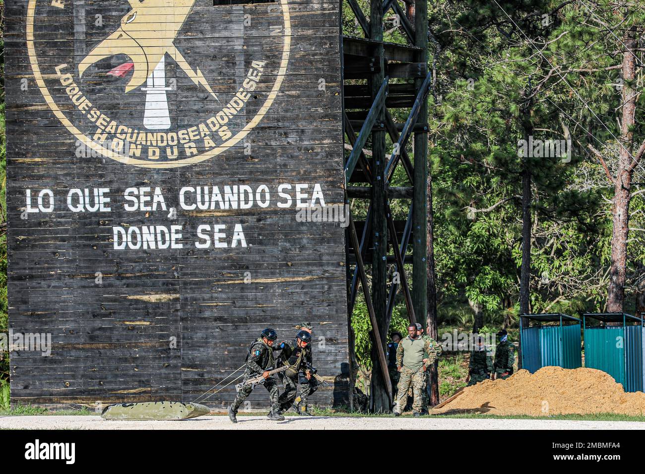 The Honduran sniper team drag a sled during the combined sniper assault ...