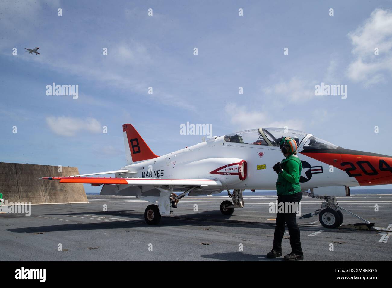 A T-45C Goshawk, attached to Training Air Wing 2, flies over USS Gerald ...