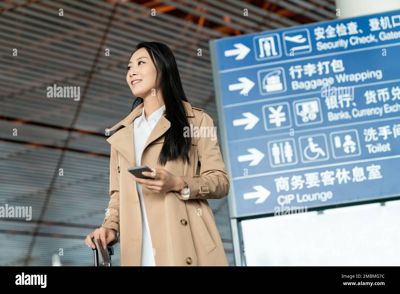 Business woman make a phone call at the airport Stock Photo - Alamy