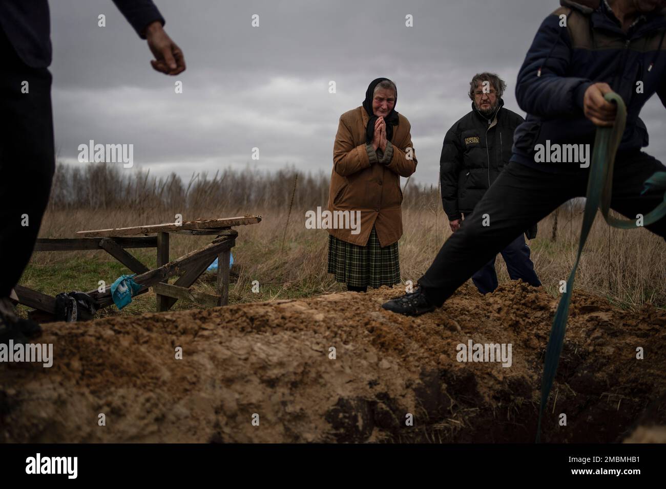 Nadiya Trubchaninova, 70, center, and her son Oleg, 46, attend the funeral of her son Vadym, 48 ...