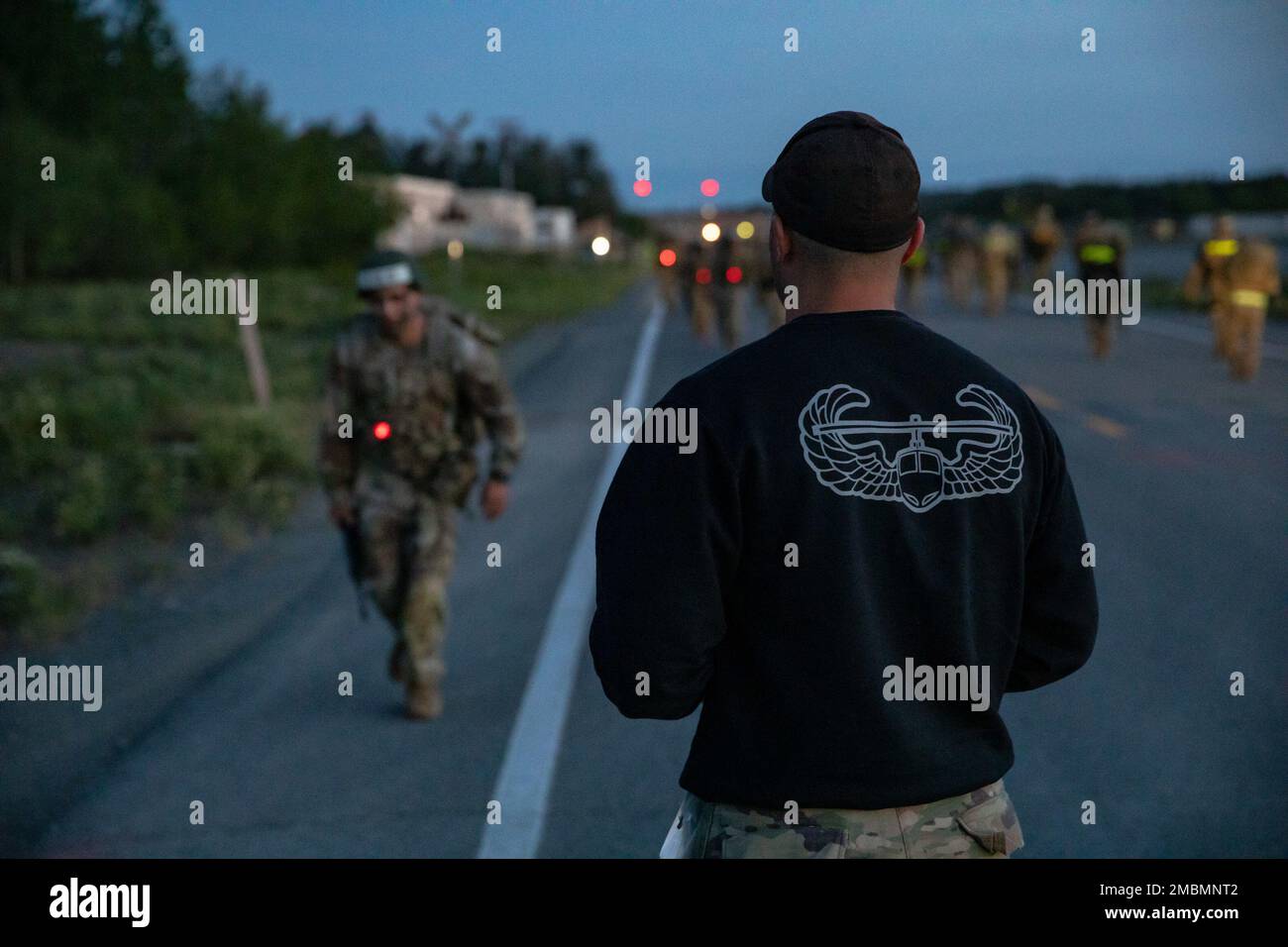 An Instructor from 25th Infantry Division’s Lightning Academy waits at ...