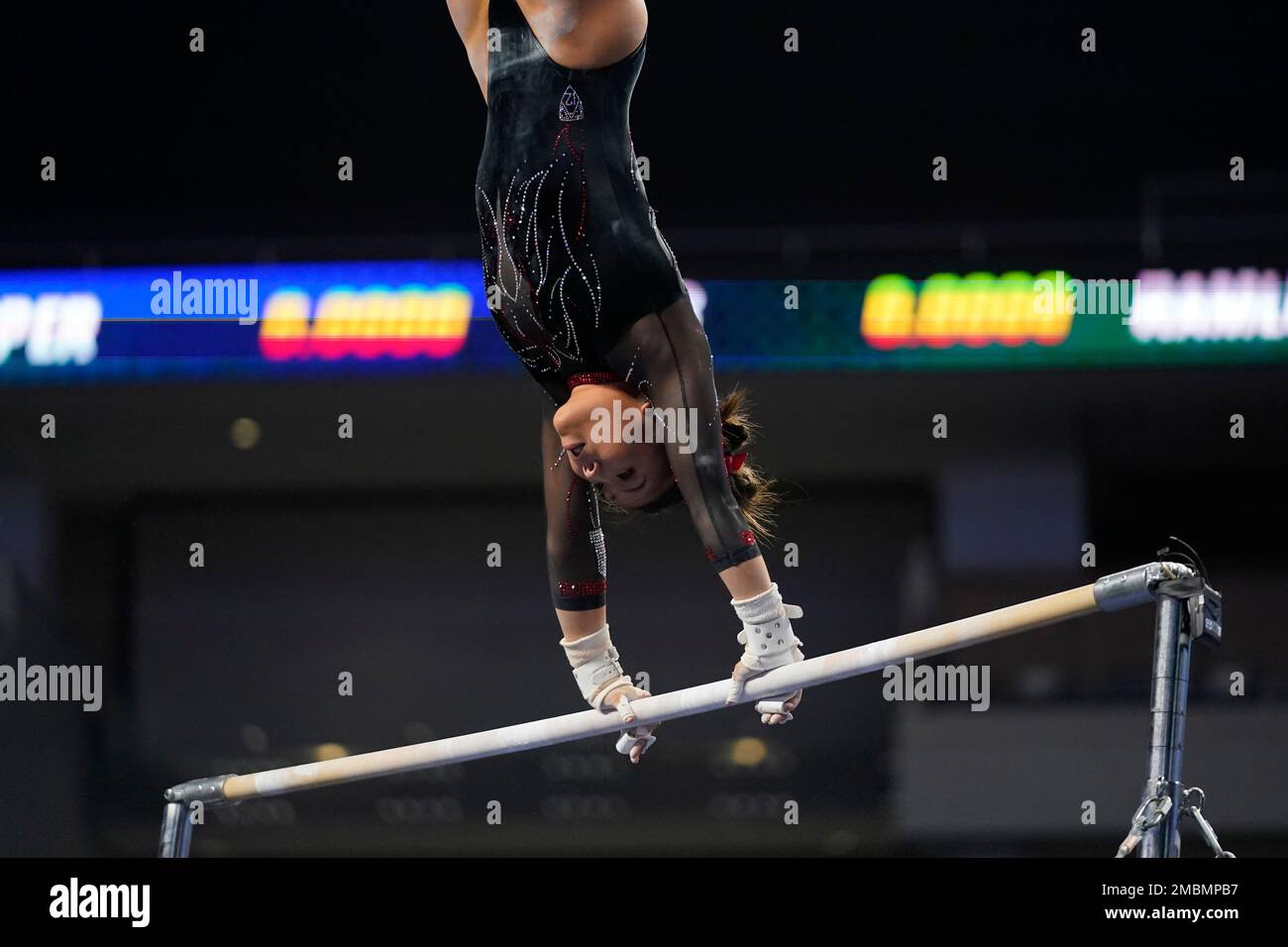 Utah's Cristal Isa competes on the uneven bars during the NCAA college ...