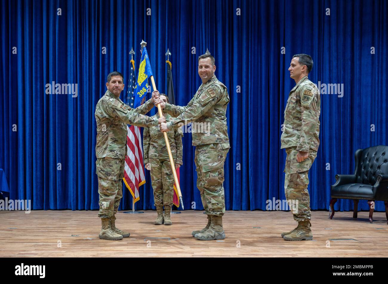 U.S. Air Force Lt. Col. Benjamin E. Carlson, center, outgoing commander ...