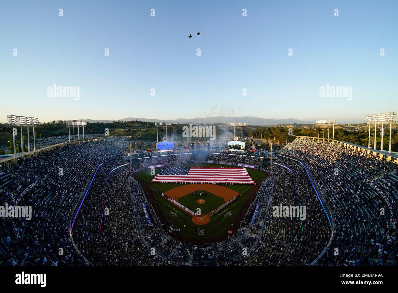 Planes fly over Dodger Stadium as the national anthem is sung before a ...