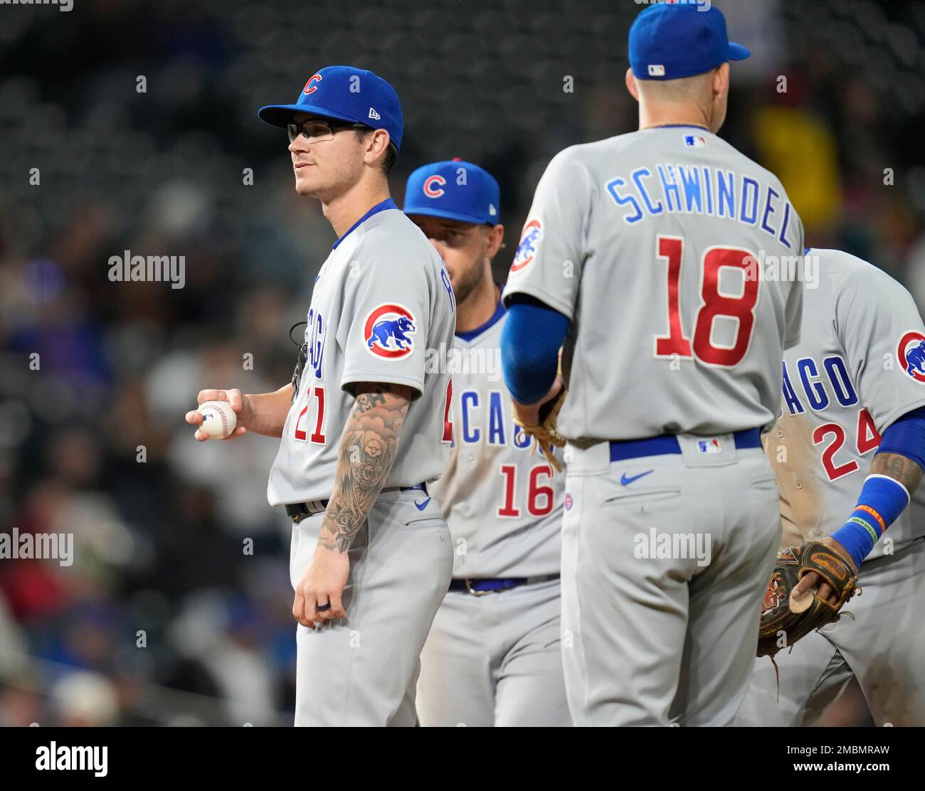 Chicago Cubs relief pitcher Ethan Roberts, left, waits to be pulled ...