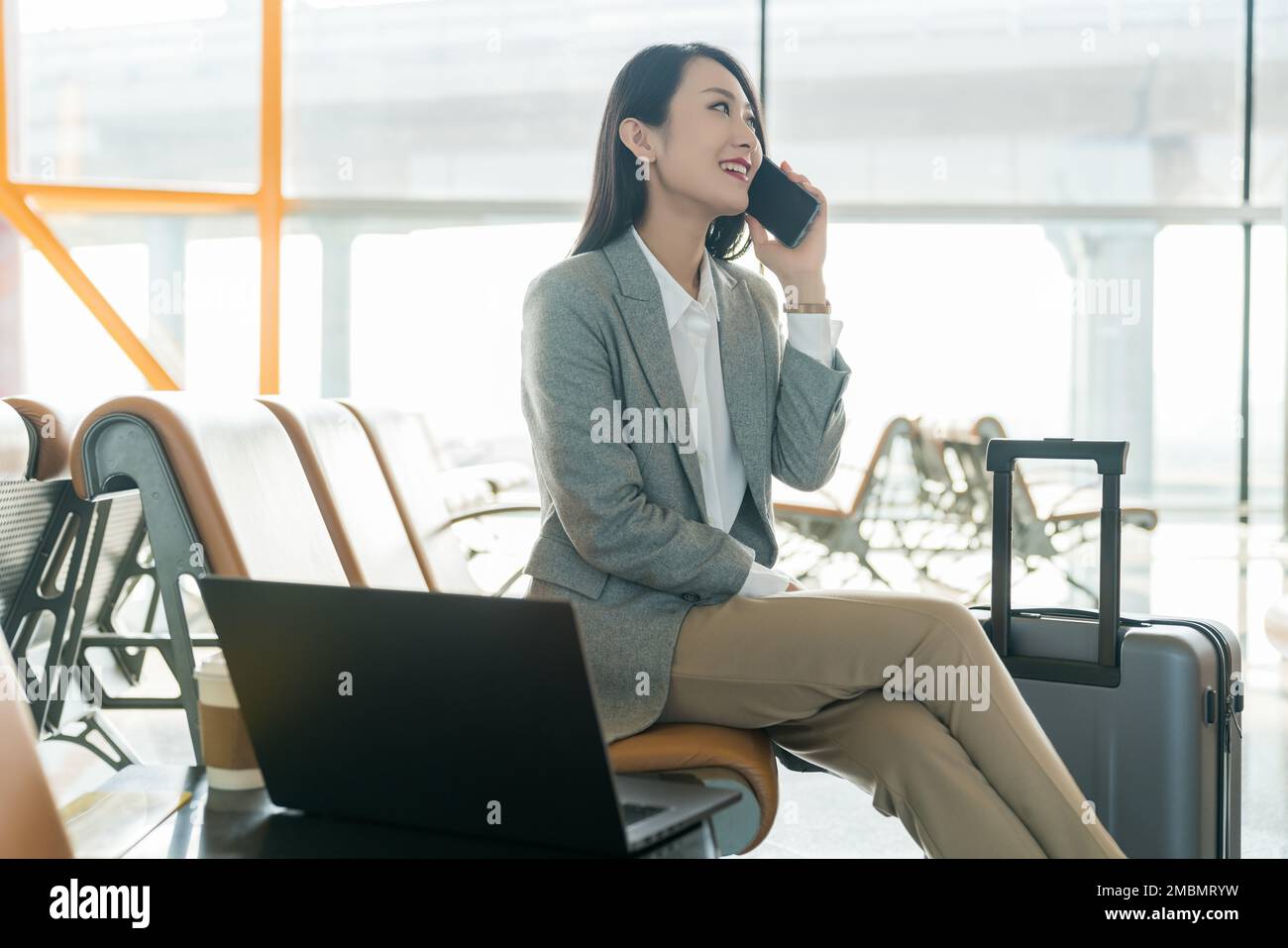 Ms business call waiting at the airport Stock Photo - Alamy