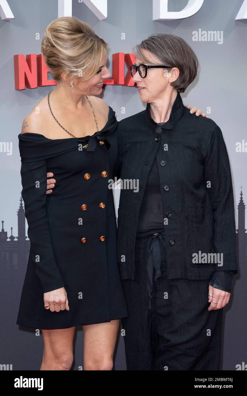 Sienna Miller, left, and S.J. Clarkson pose for photographers upon ...