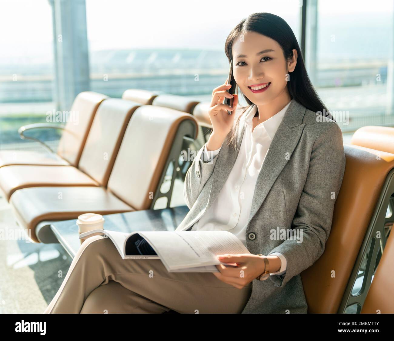 Ms business call waiting at the airport Stock Photo - Alamy
