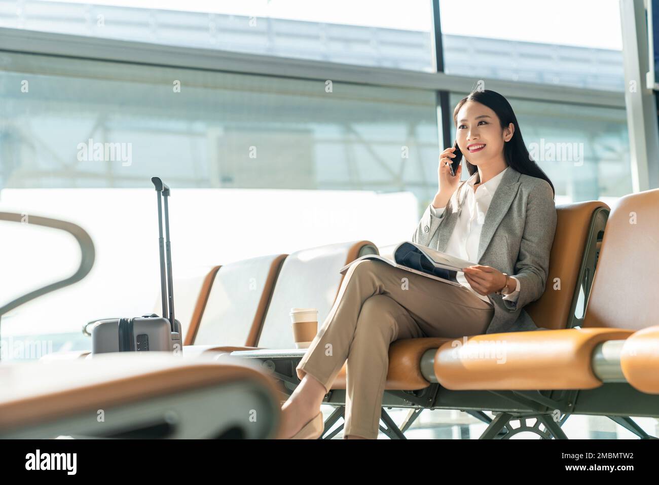 Ms business call waiting at the airport Stock Photo - Alamy