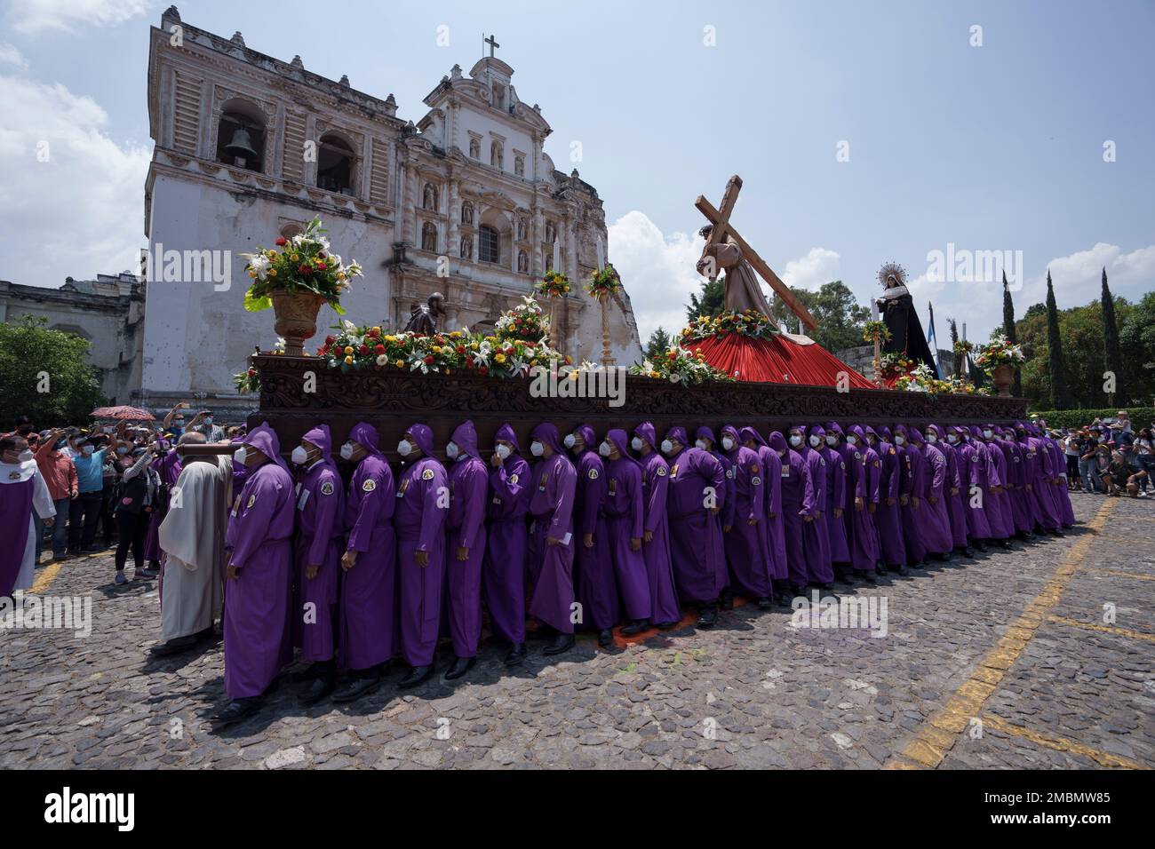 "Cucuruchos" carry a statue of Jesus Christ on a religious float during ...
