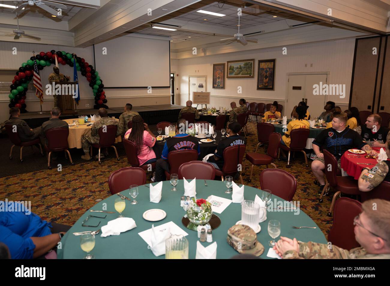 Patrons of Kunsan Air Base listen to Col. Anthony L. Mitchell, 8th ...