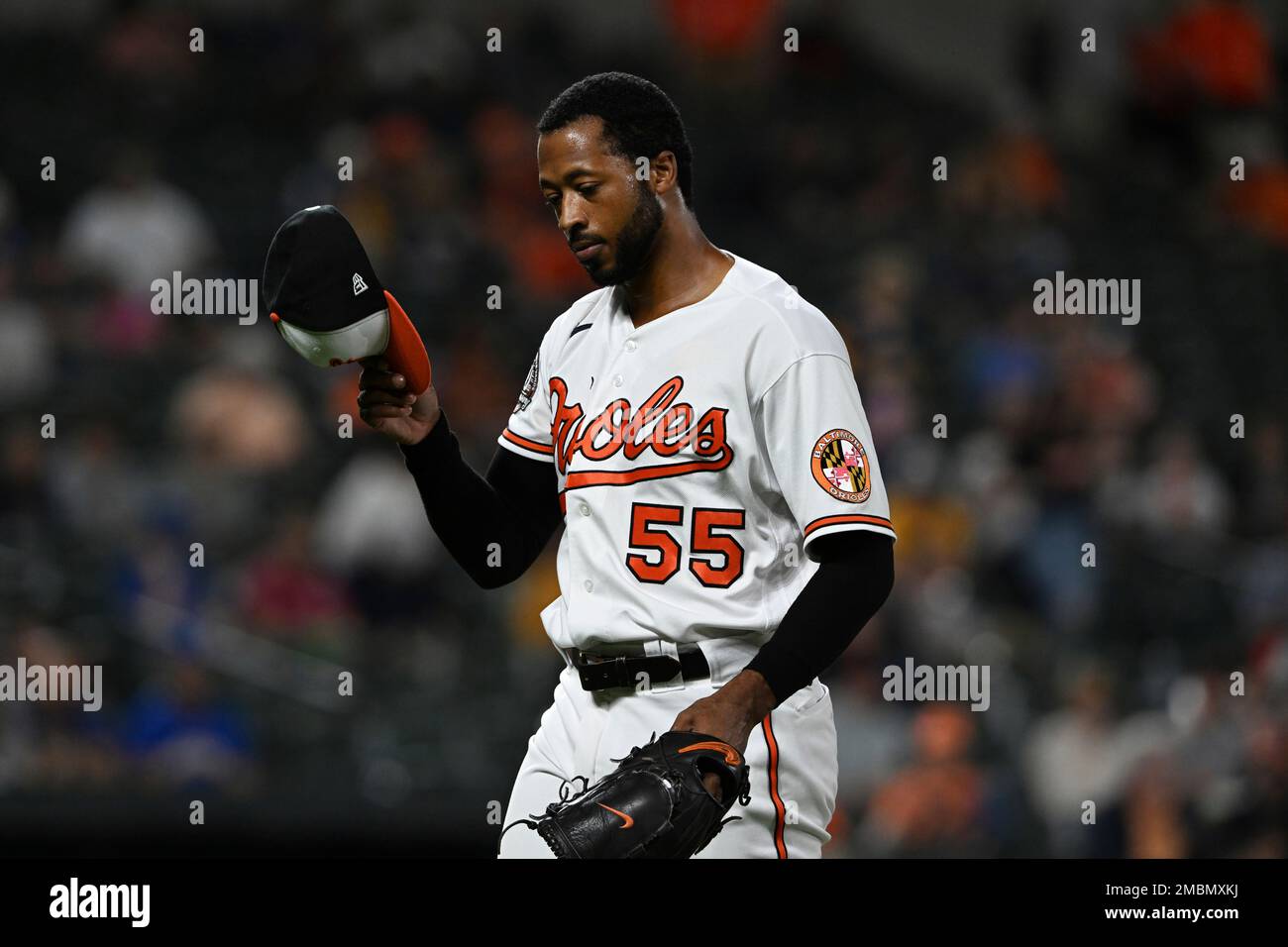Baltimore Orioles pitcher Dillon Tate reacts after retiring the side in ...