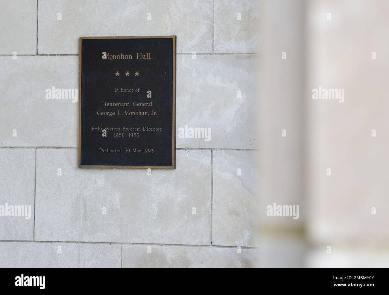 A plaque next to the entrance of Building 12 on Area B honors Lt. Gen ...