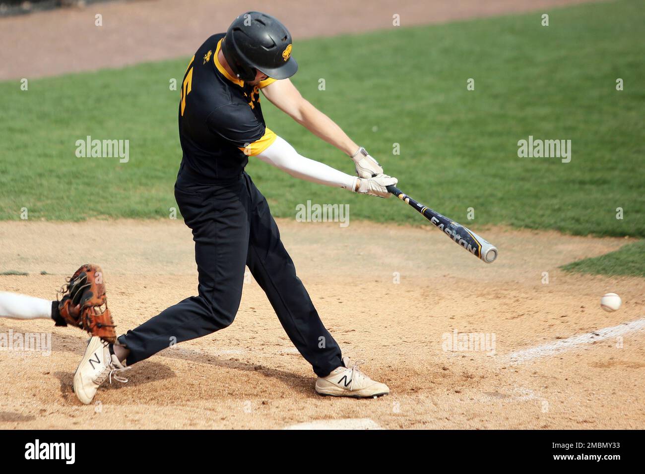 UMBC infielder Logan Doran (15) takes a swing during an NCAA baseball ...