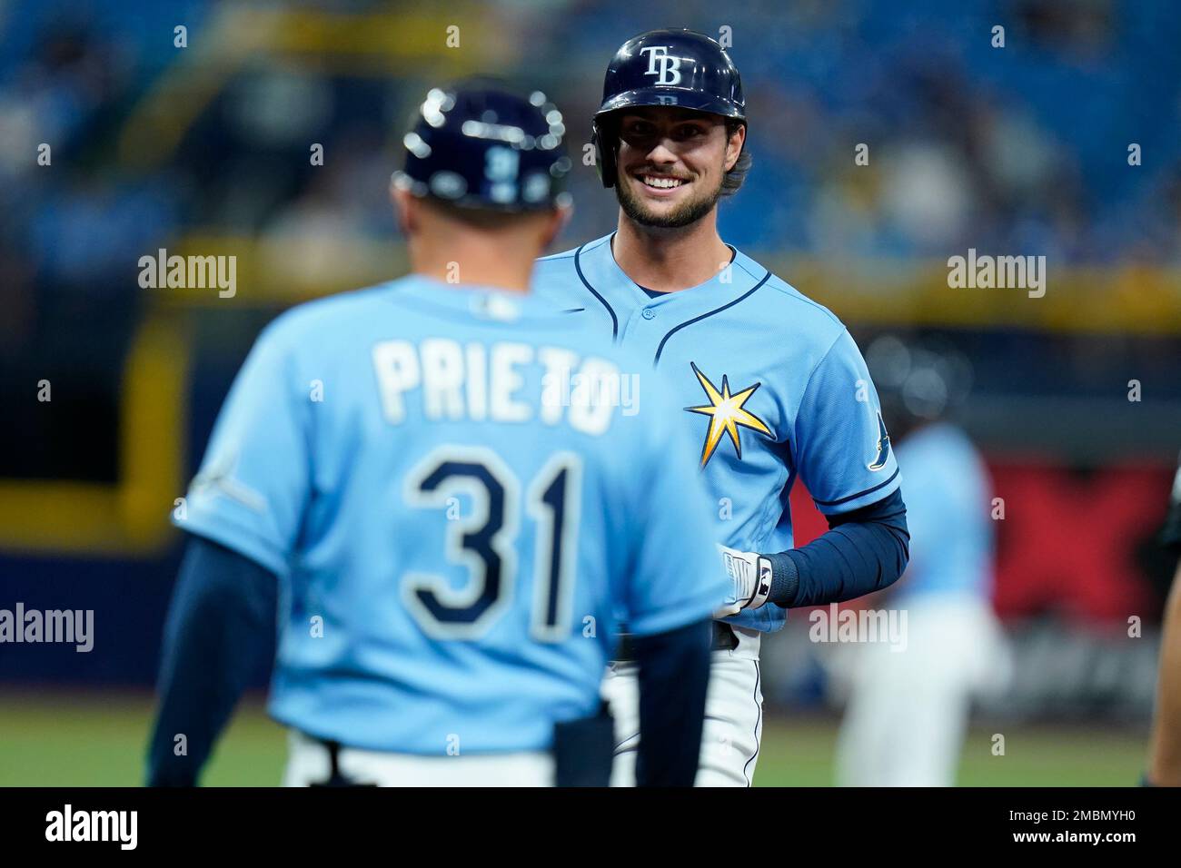 Tampa Bay Rays' Josh Lowe smiles at first base coach Chris Prieto (31 ...