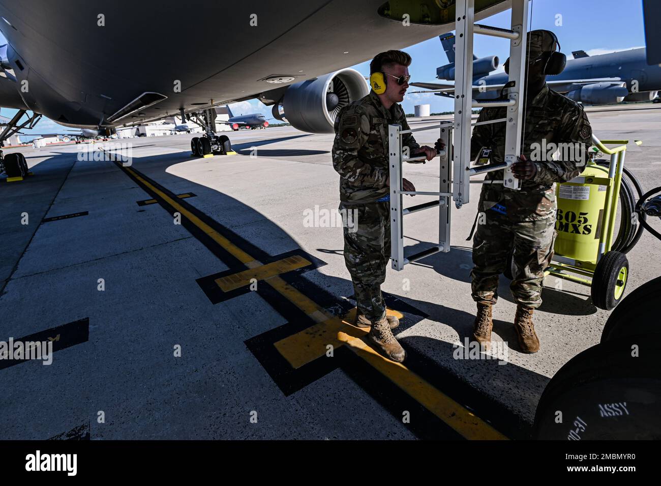Airmen assigned to the 305th Air Mobility Wing conduct a post-flight ...