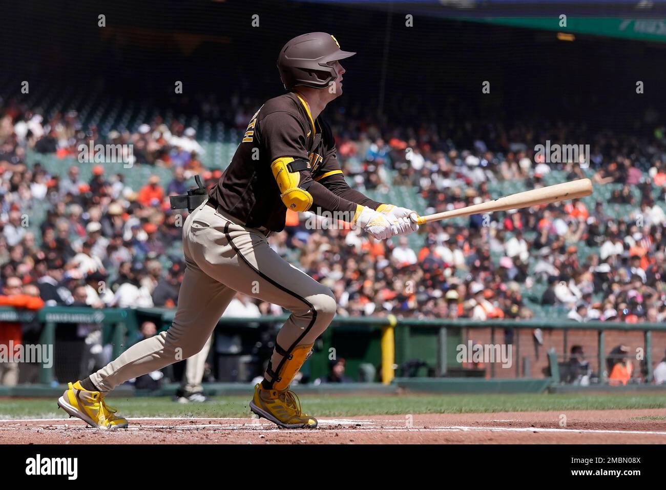 San Diego Padres' Jake Cronenworth watches his RBI-triple during the ...