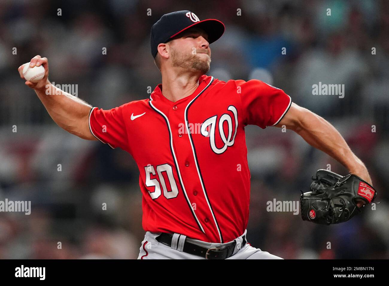 Washington Nationals starting pitcher Austin Voth (50) delivers against ...
