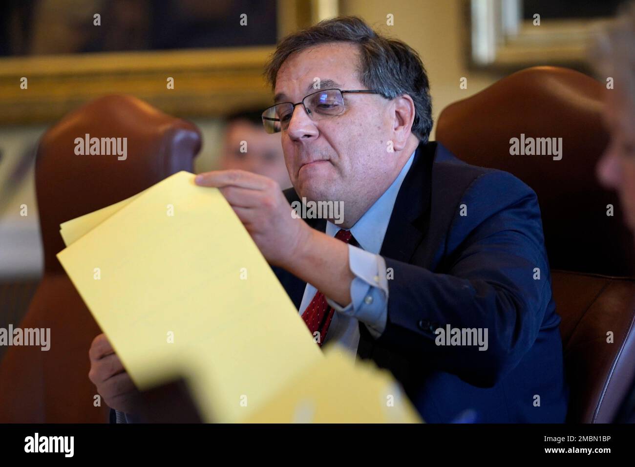 Sen. Mark Lawrence, D-York, reviews papers in the Senate chamber at the ...
