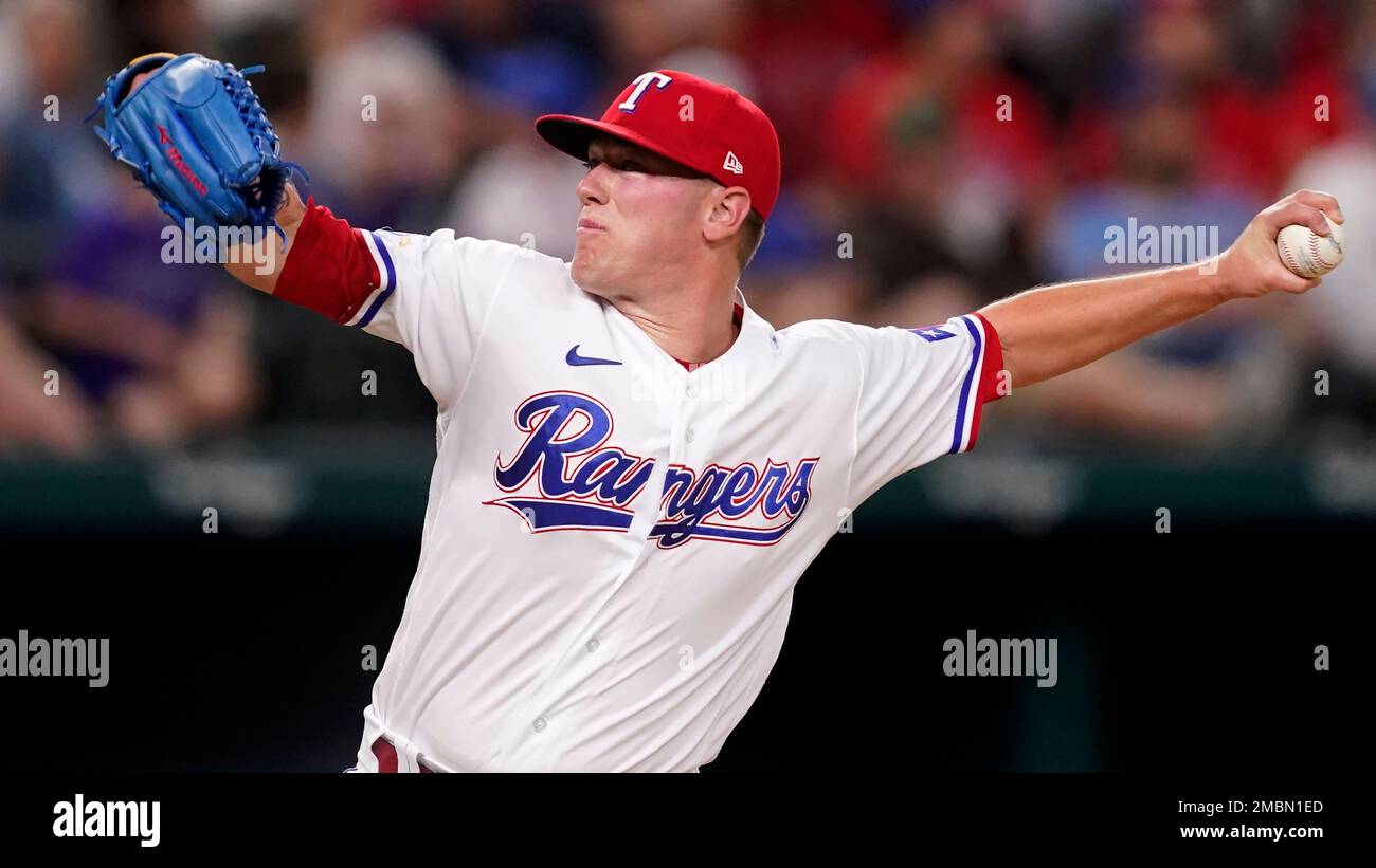 Texas Rangers' Kolby Allard winds up to deliver to the Colorado Rockies ...