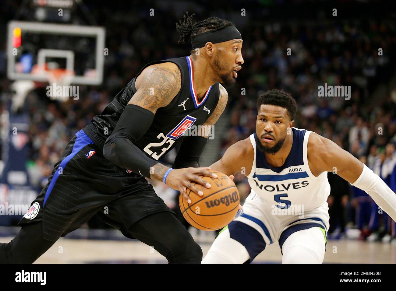 Los Angeles Clippers forward Robert Covington (23) drives on Minnesota ...