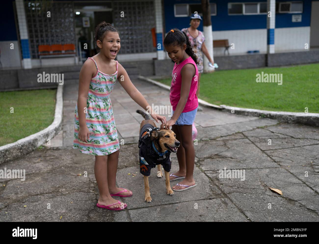 Children pet police dog "Corporal Oliveira" at the 17 Military Police ...
