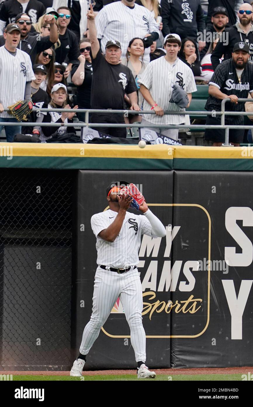 Chicago White Sox left fielder Eloy Jimenez catches a fly ball hit by ...