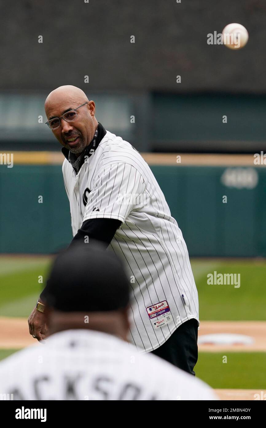 Former Chicago White Sox player Harold Baines throws out the ceremonial first pitch before an ...