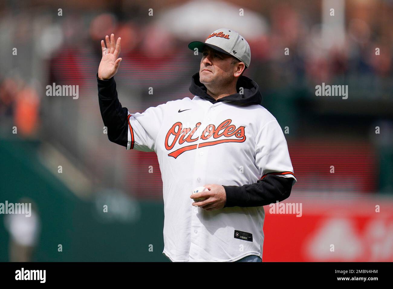 Baltimore firefighter John McMaster gestures before throwing out a ...