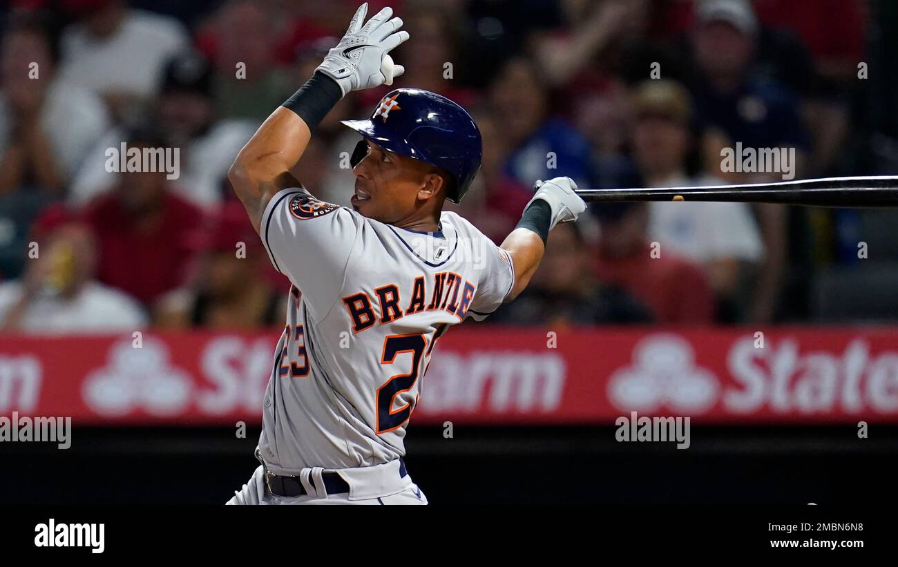 Houston Astros designated hitter Michael Brantley (23) follows through ...