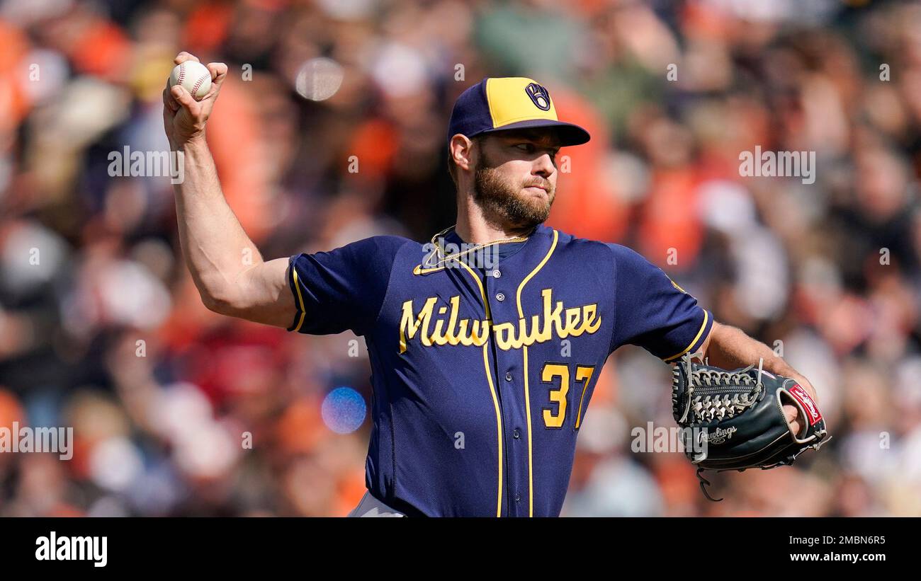 Milwaukee Brewers starting pitcher Adrian Houser throws during the ...
