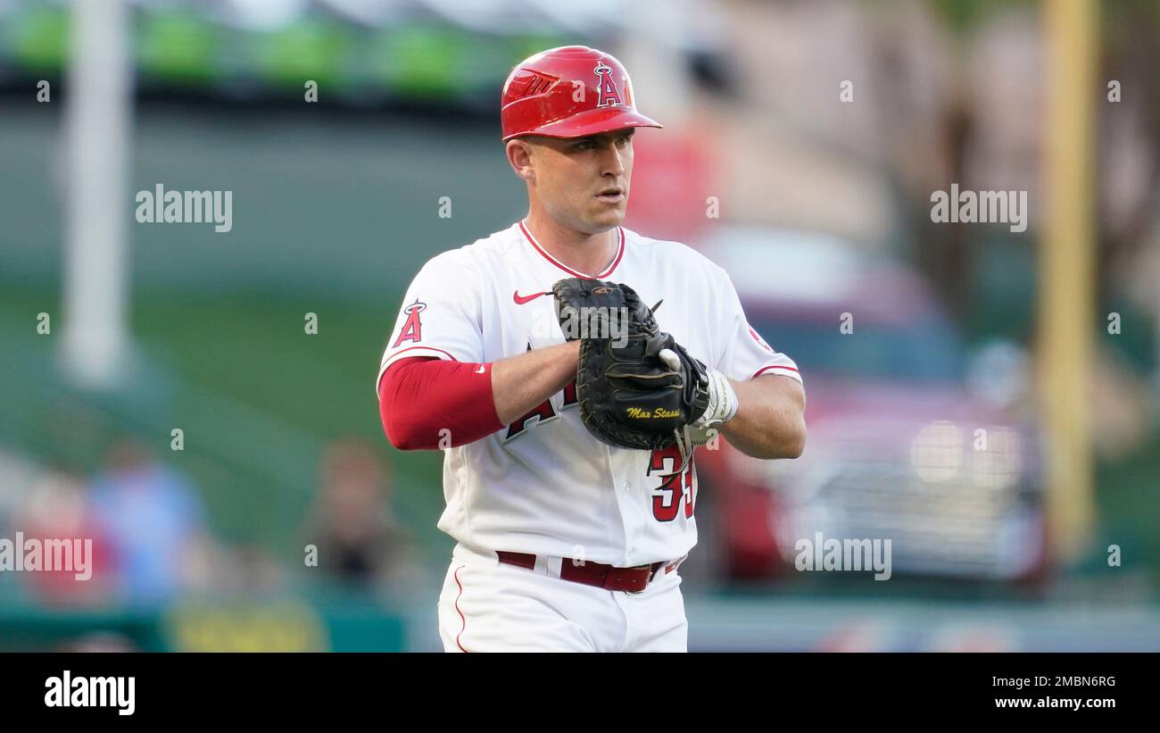 Los Angeles Angels catcher Max Stassi (33) walks on the field to warm ...