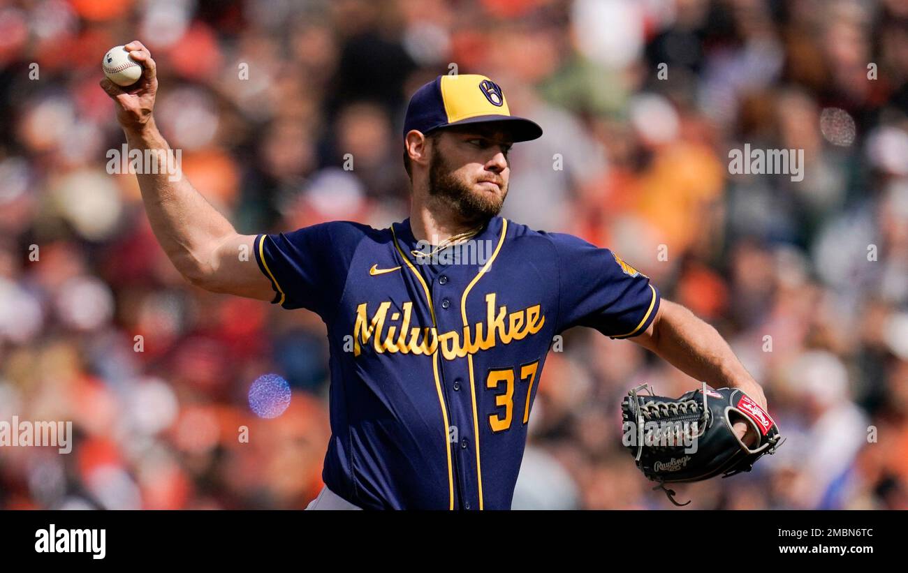 Milwaukee Brewers starting pitcher Adrian Houser throws during the ...