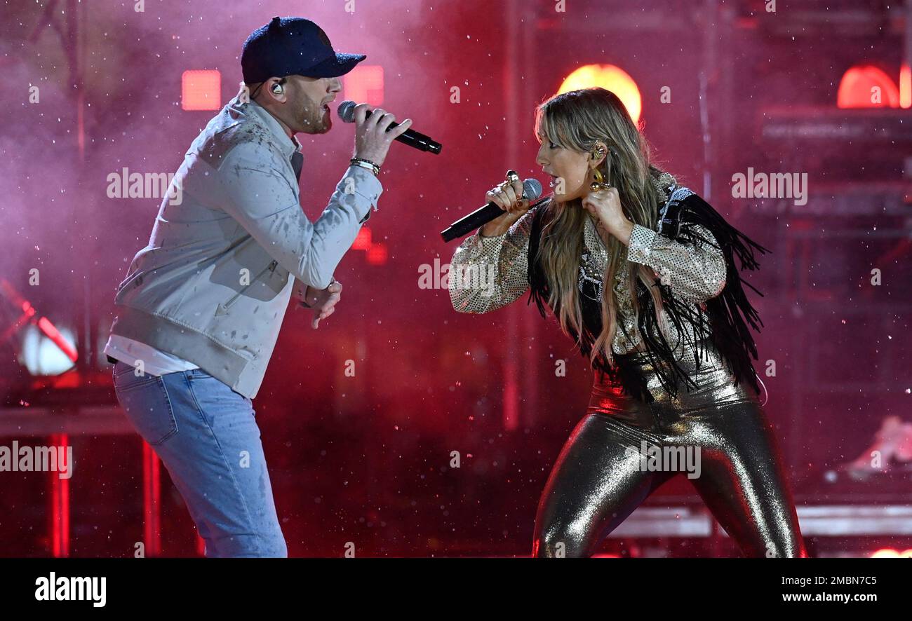 Cole Swindell, left, and Lainey Wilson perform "Never Say Never" at the ...