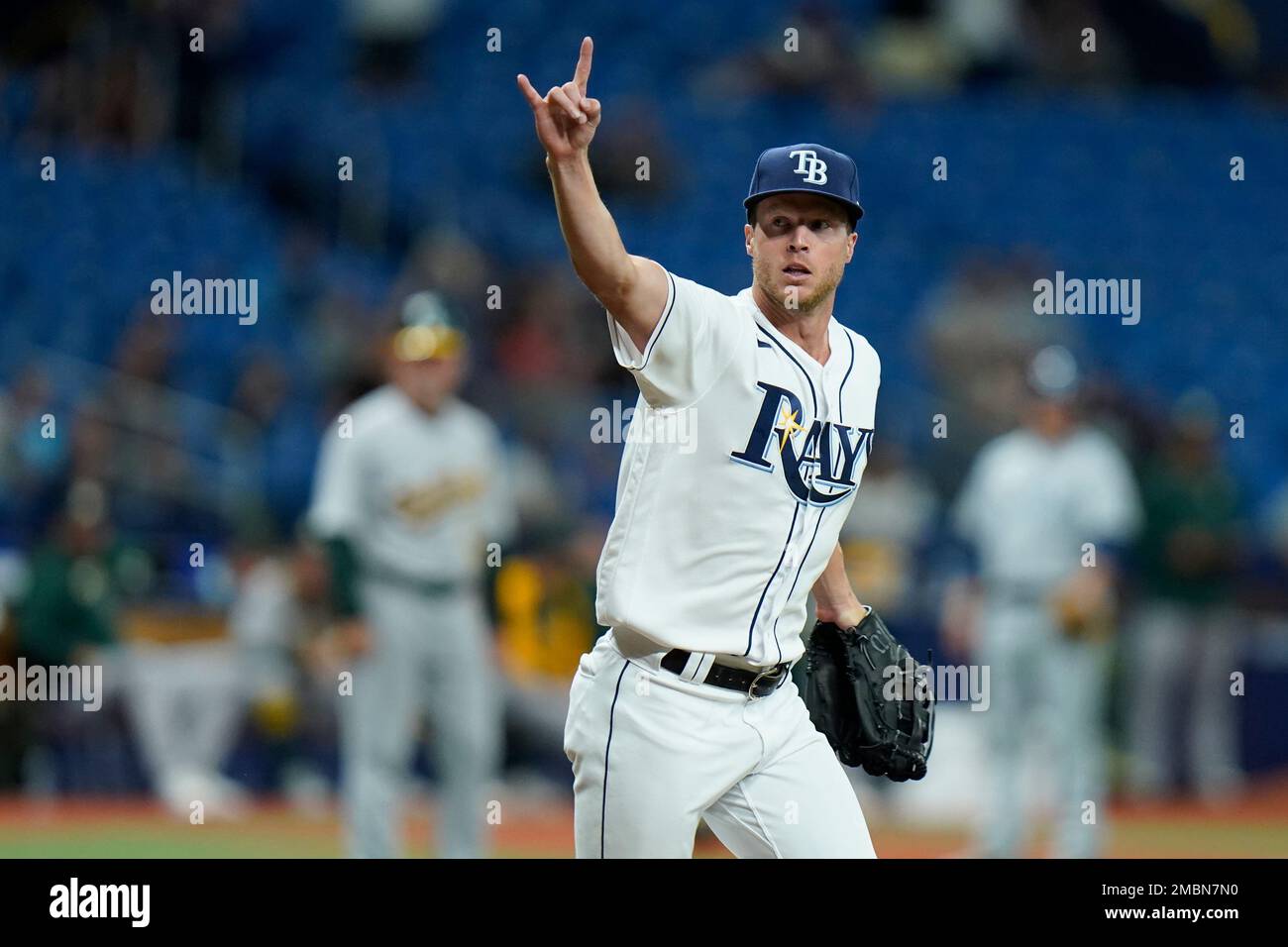 Tampa Bay Rays' Brett Phillips reacts after making a sliding catch on a ...