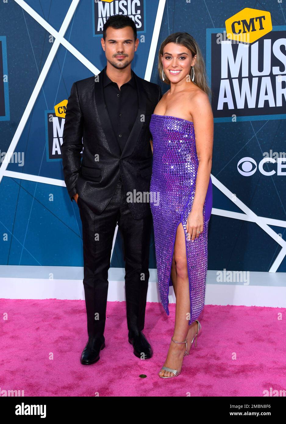 Taylor Lautner, left, and Taylor Dome arrive at the CMT Music Awards on ...