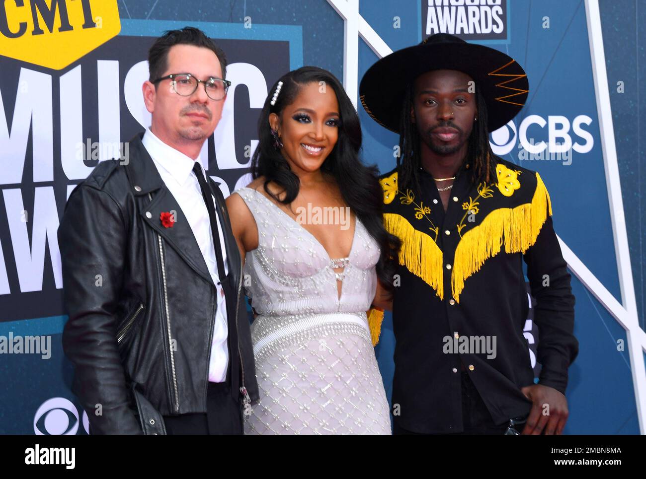 Mickey Guyton, center, Adrian Quesada, left, and Eric Burton of Black ...