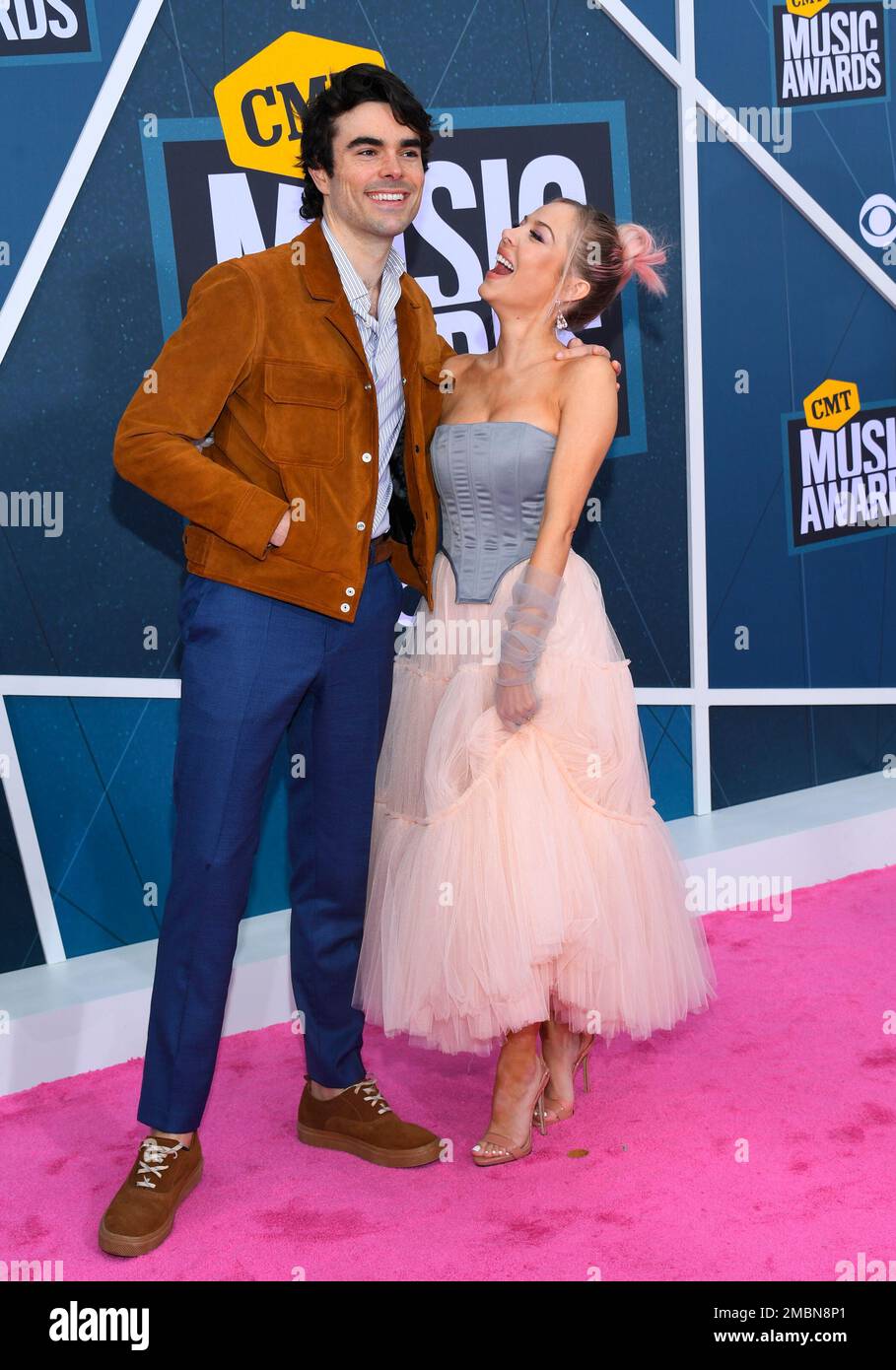 Jake Etheridge, left, and MacKenzie Porter arrive at the CMT Music ...