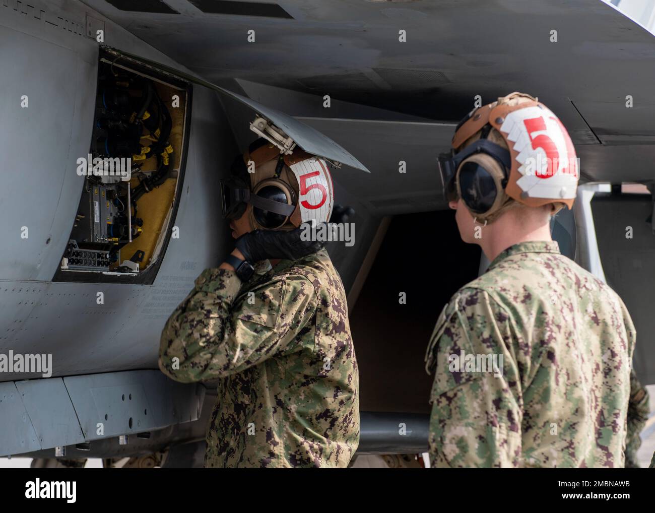 U.S. Navy Strike Fighter Squadron 25 flight captains check the ...