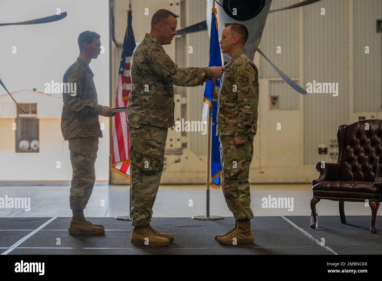 Col. Jeffrey Darden, 317th Maintenance Group commander, clips the ...