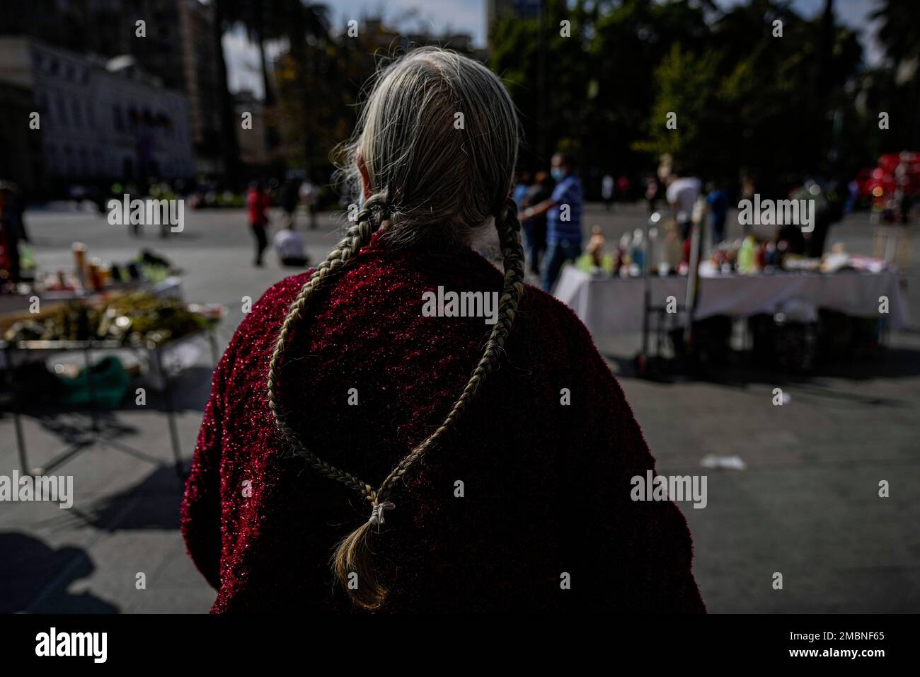 An elderly woman leaves the Metropolitan Cathedral after Palm Sunday ...
