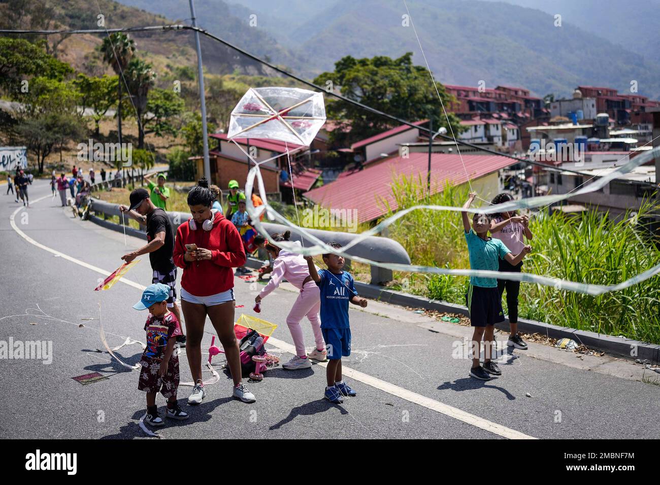 Children fly their kites known in Venezuela as a Papagayos during a ...
