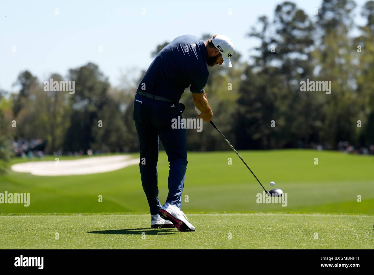 Dustin Johnson tees off on the fifth hole during the final round at the ...