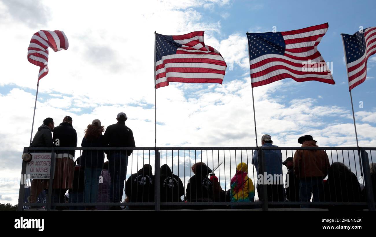 American flags fly over supporters before former President Donald Trump ...
