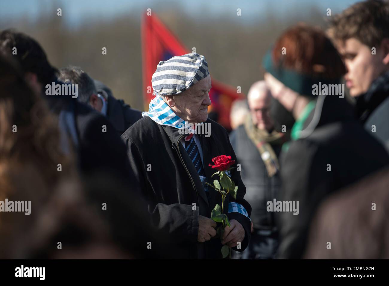 Nazi concentration camp survivor Alojzy Maciak holds a flower during a ...