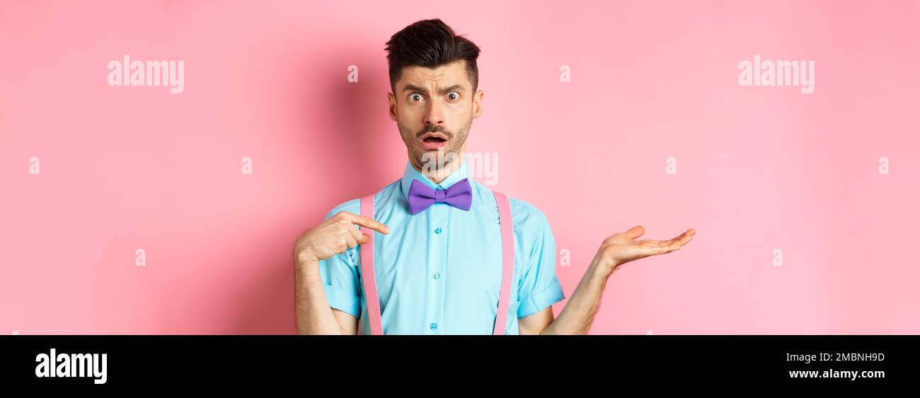 Shocked and confused guy pointing at himself with disbelief, being ...